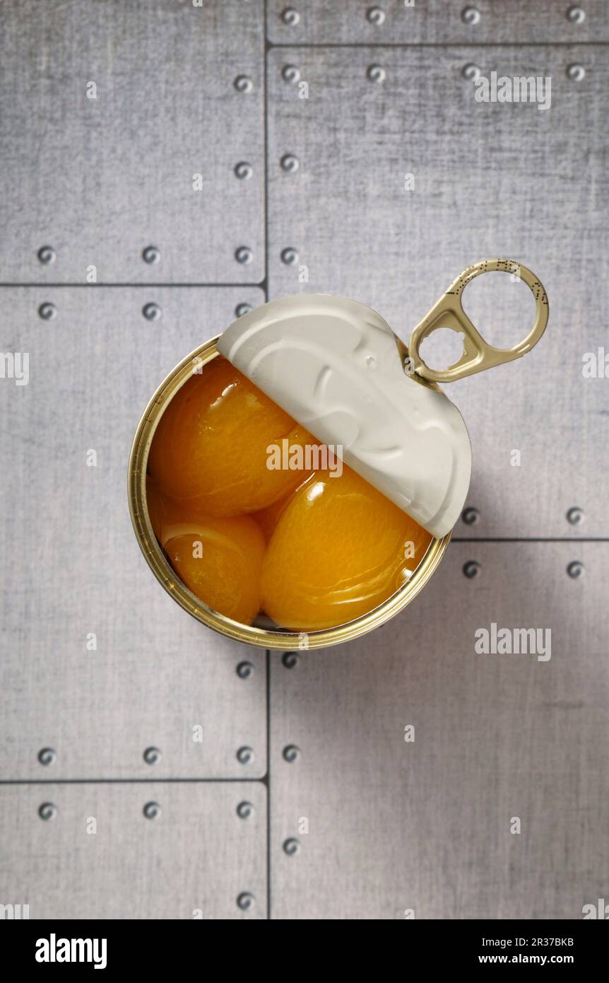 Tinned peaches in syrup hi-res stock photography and images - Alamy