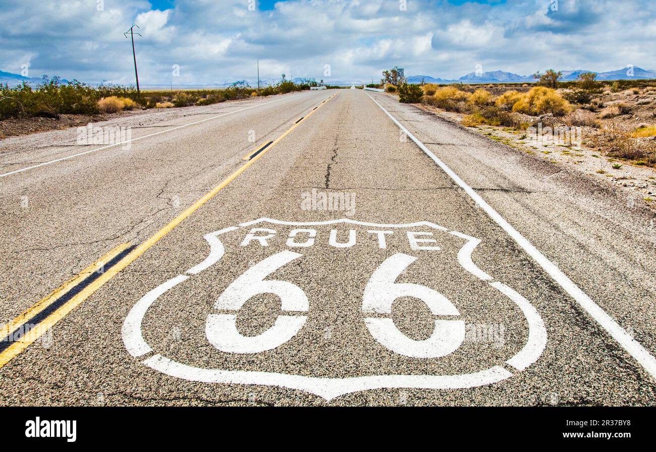 Route 66 road sign with blue sky background. Historic street with ...