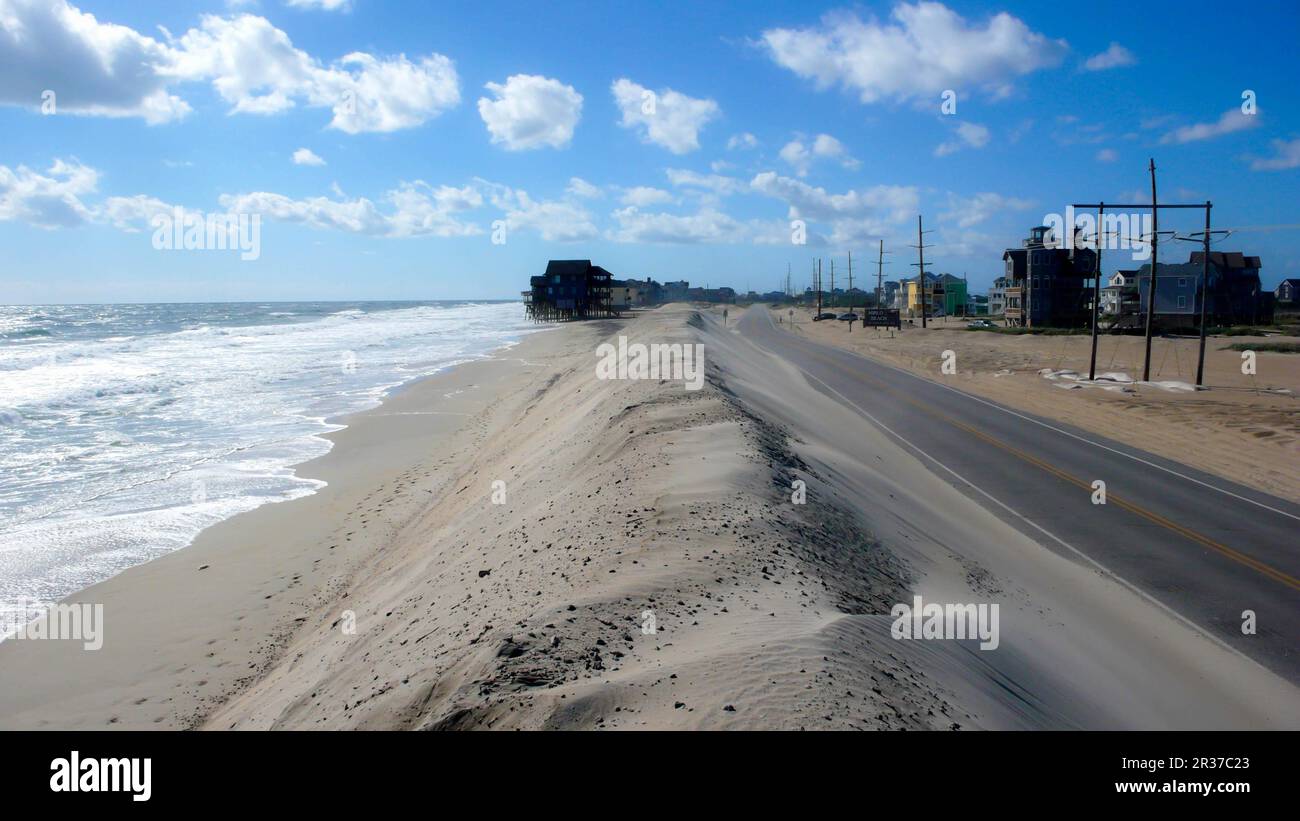 Outer Banks of North Carolina village and sand dunes with empty highway ...