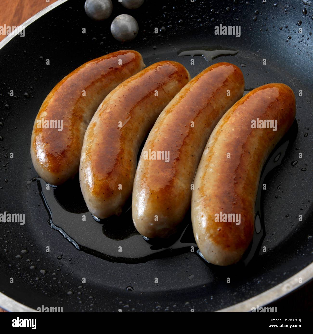 English bangers (breakfast sausages) in skillet Stock Photo - Alamy