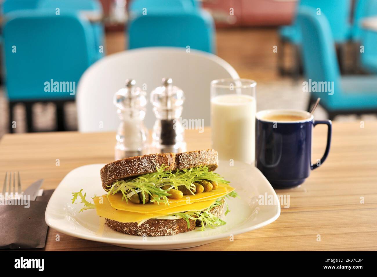 Old Dutch Cheese Sandwich with pickels and salad coffee and a glas of ...