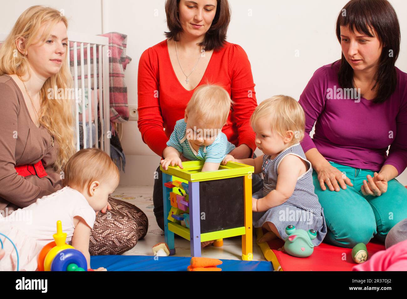 Group of mothers with their babies Stock Photo - Alamy