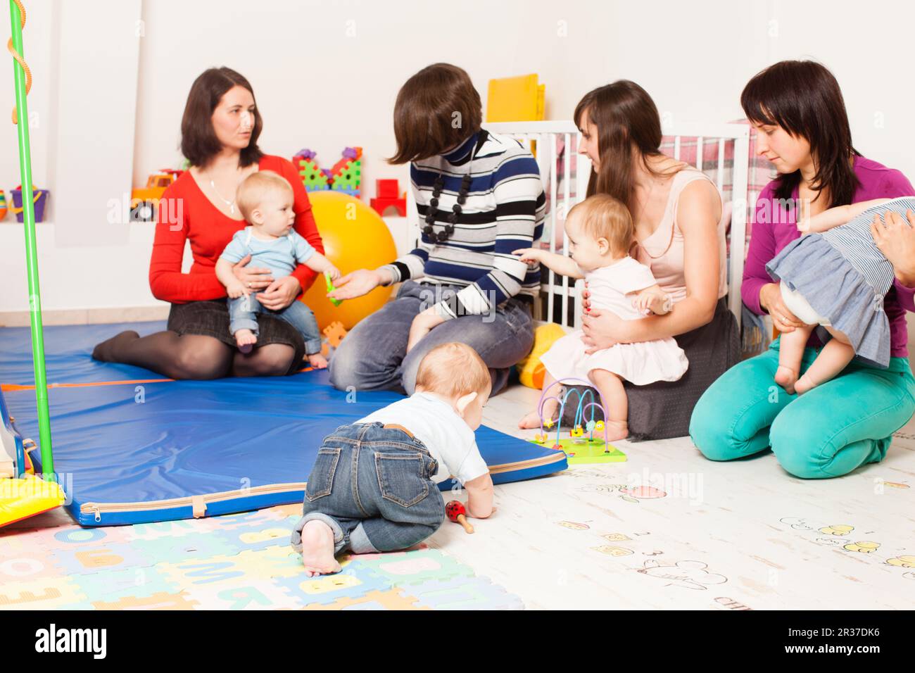 Group of mothers with their babies Stock Photo - Alamy