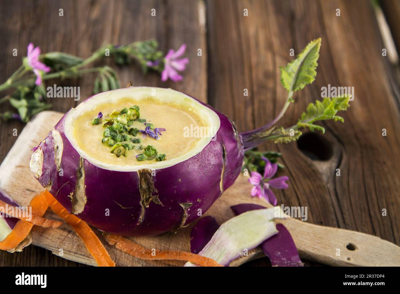 Vegetable cream soup with mallow served in a hollowed out kohlrabi ...