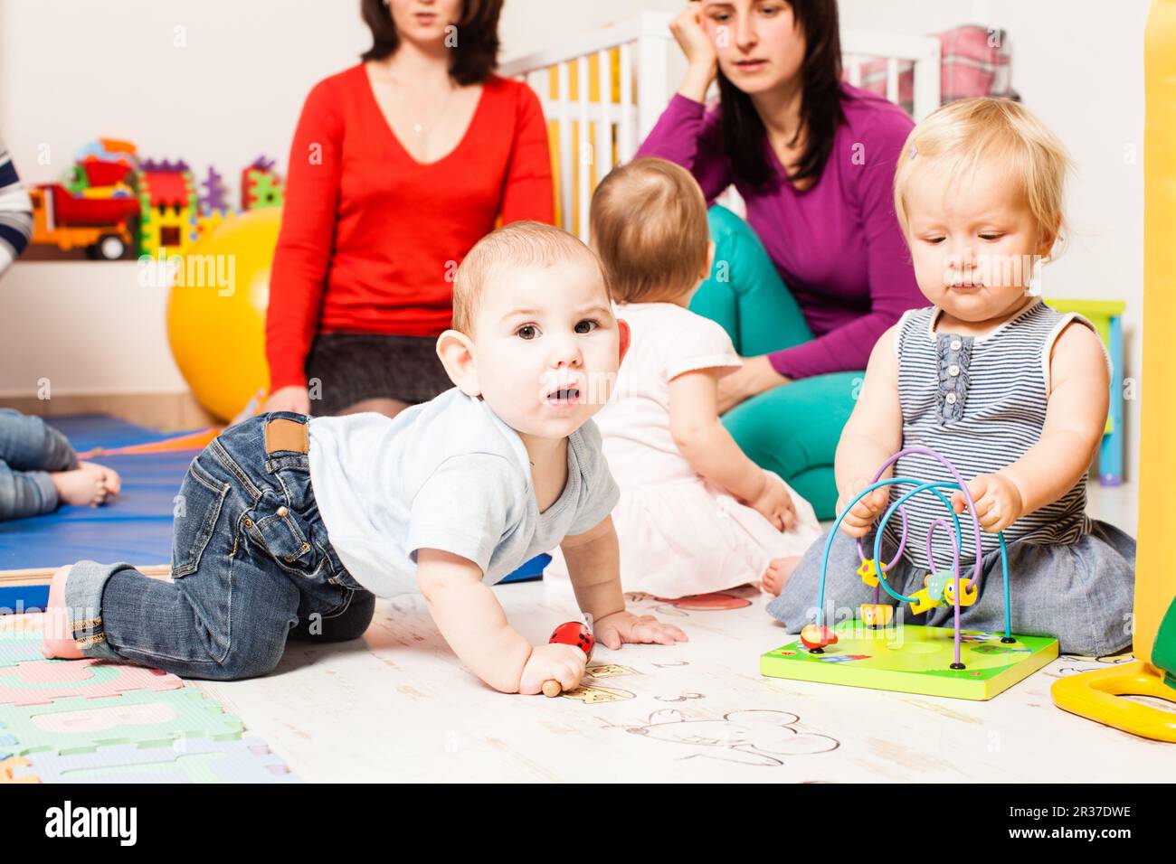 Group of mothers with their babies Stock Photo - Alamy