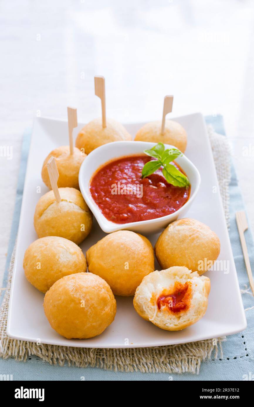 Deep-fried pizza panzerotti with tomato sauce Stock Photo - Alamy