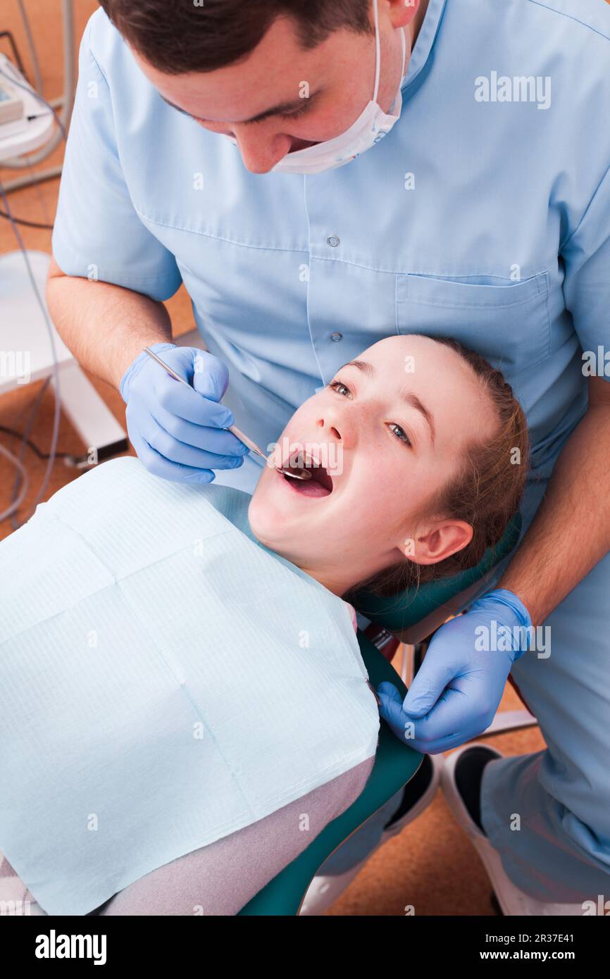 Dentist examines patient teeth dental hi-res stock photography and ...