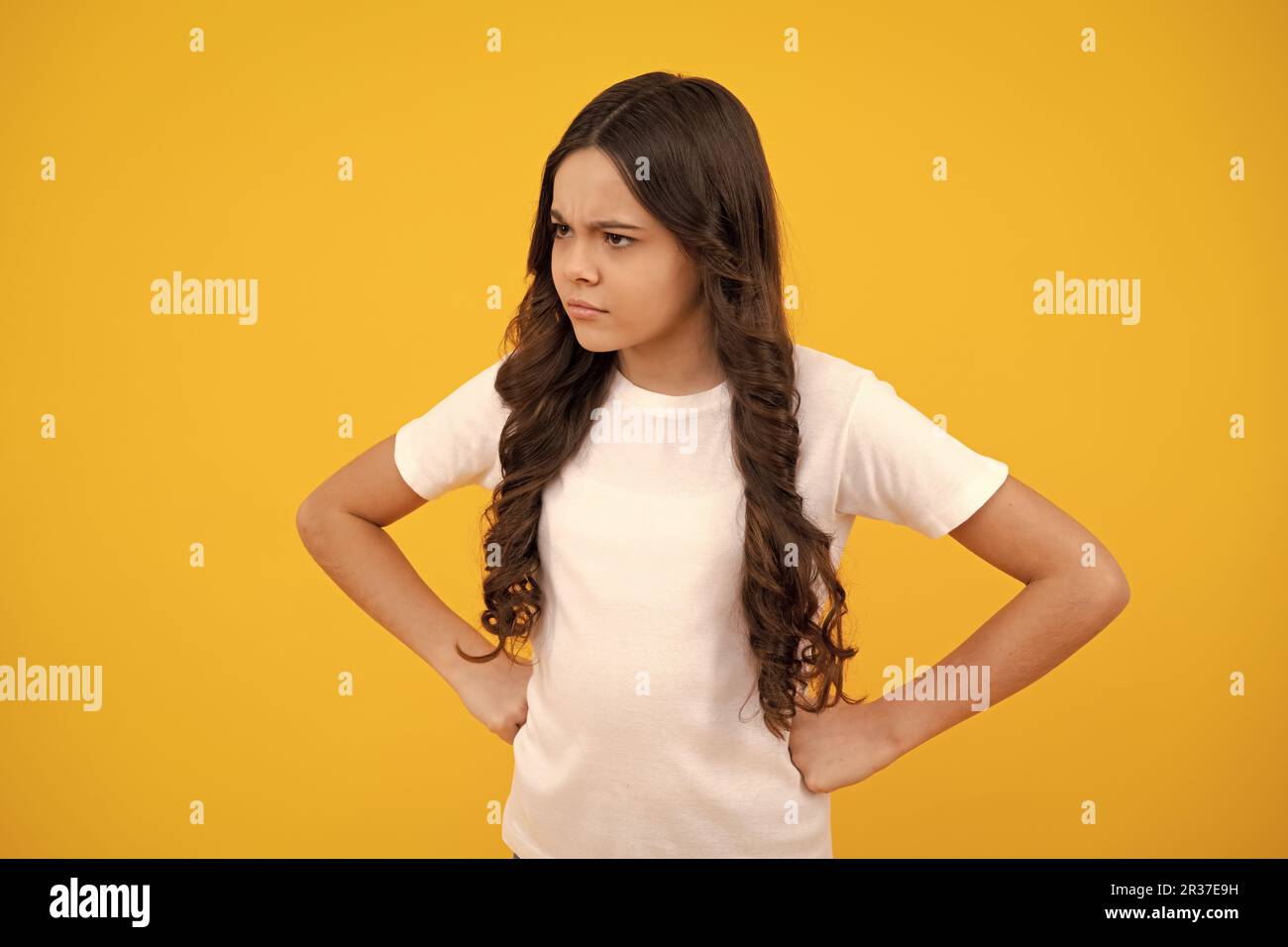 Angry teen girl. Child looking at camera with hate and rage negative ...