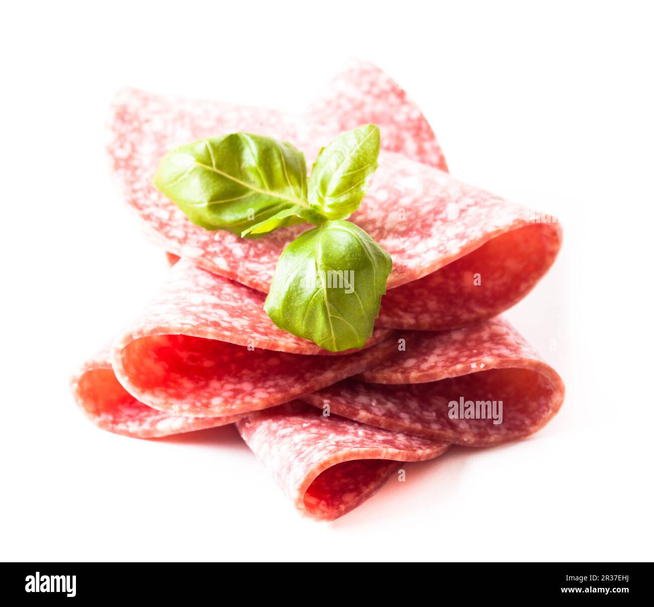 Salami slices isolated Stock Photo - Alamy