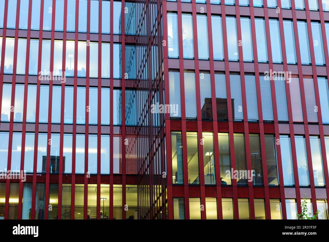 Facade of a modern red office building Stock Photo - Alamy