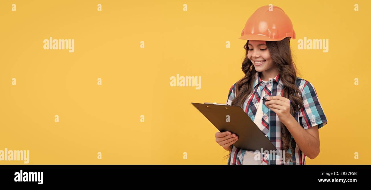 future engineer hold clipboard. safety work expertise. teen girl in ...