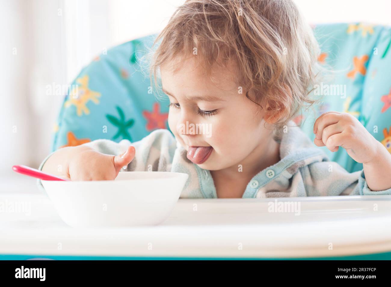 Little girl eating soup hi-res stock photography and images - Alamy