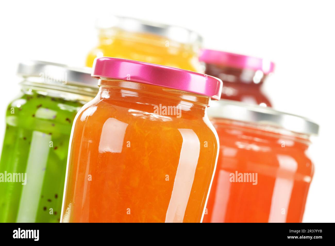 Jars of fruity jams isolated on white background. Preserved fruits ...