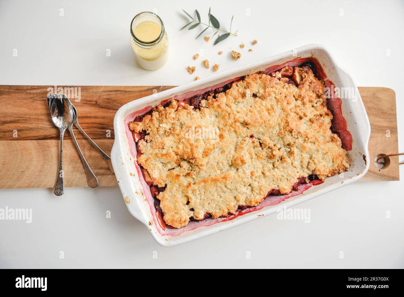 Apple crumble with custard Stock Photo - Alamy