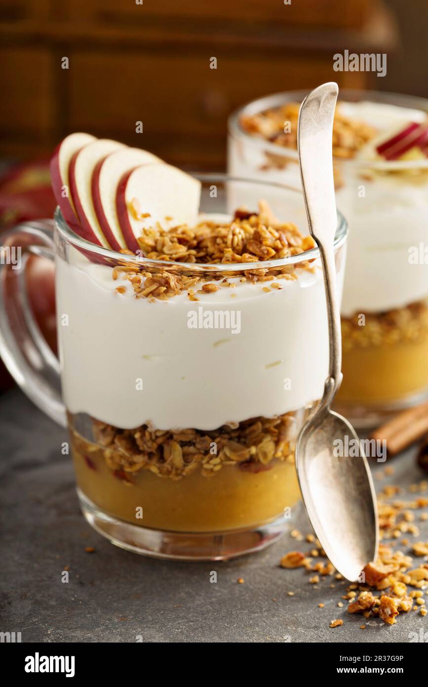 Layered yogurt and applesauce parfait with granola Stock Photo - Alamy