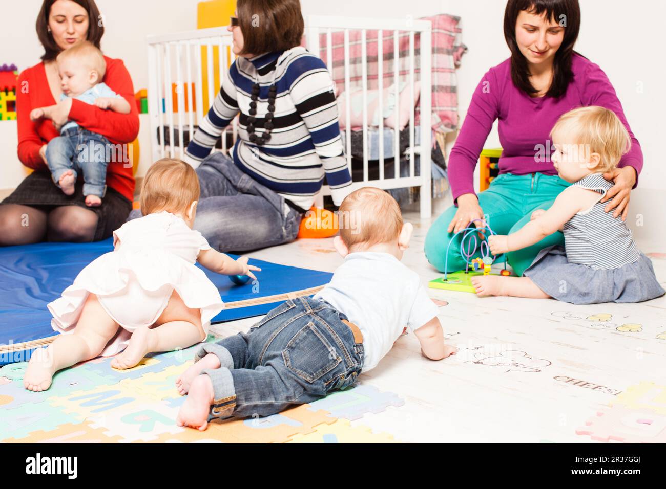 Group of mothers with their babies Stock Photo - Alamy