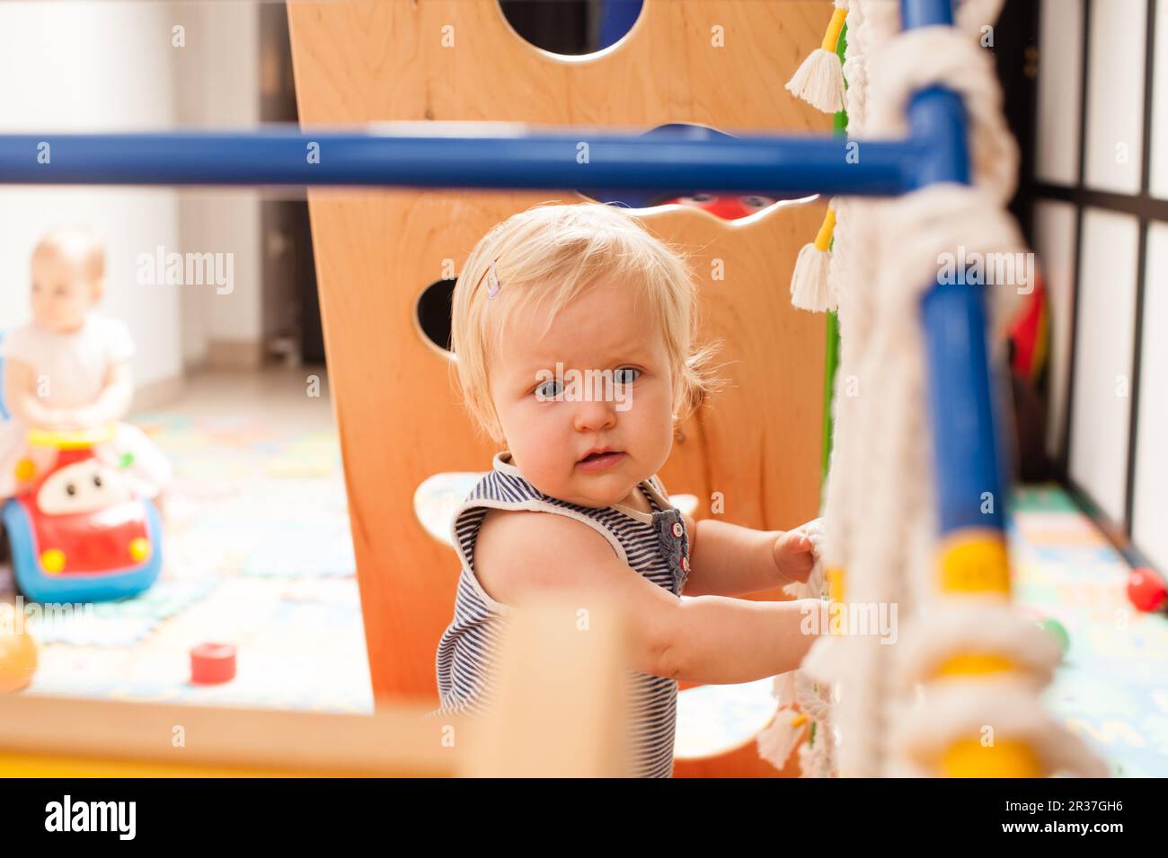 The baby playing on the playground Stock Photo - Alamy