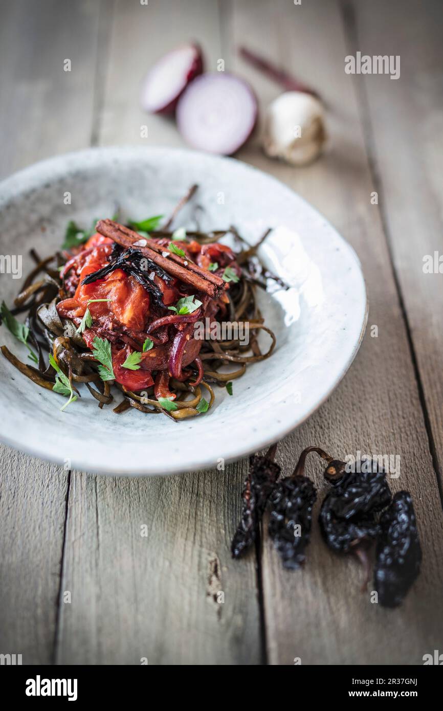 Seaweed pasta with smoked chilli Stock Photo - Alamy