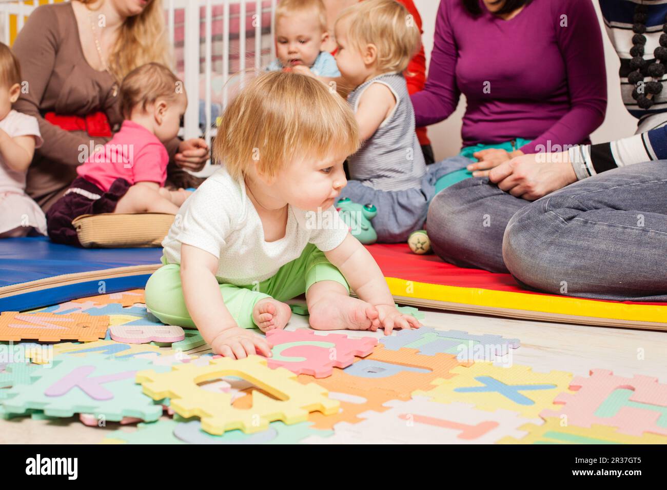 Group of mothers with their babies Stock Photo - Alamy