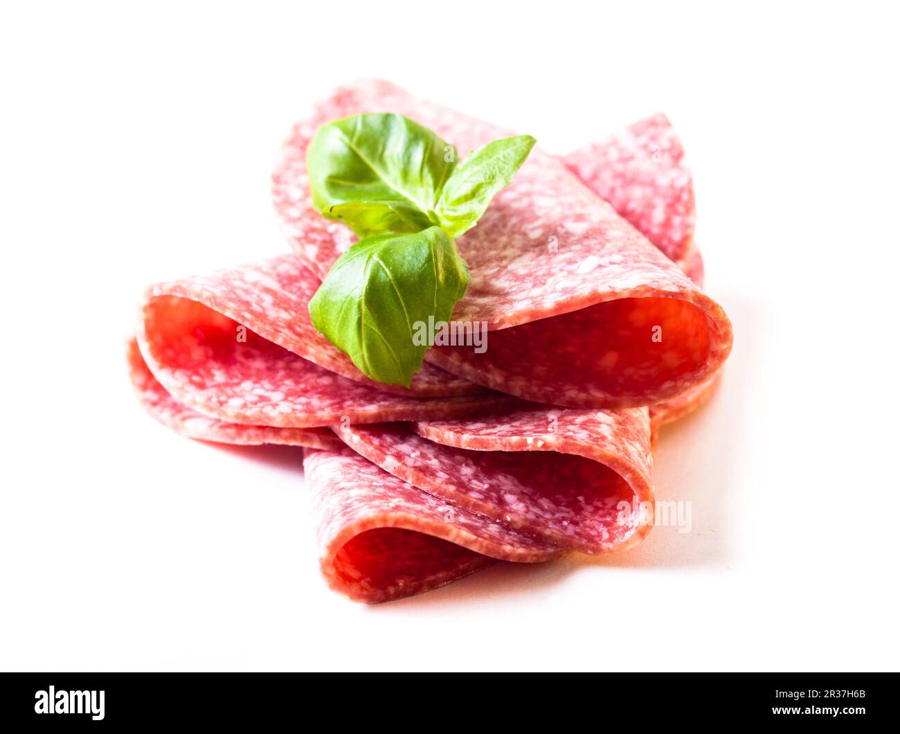 Salami slices isolated Stock Photo - Alamy