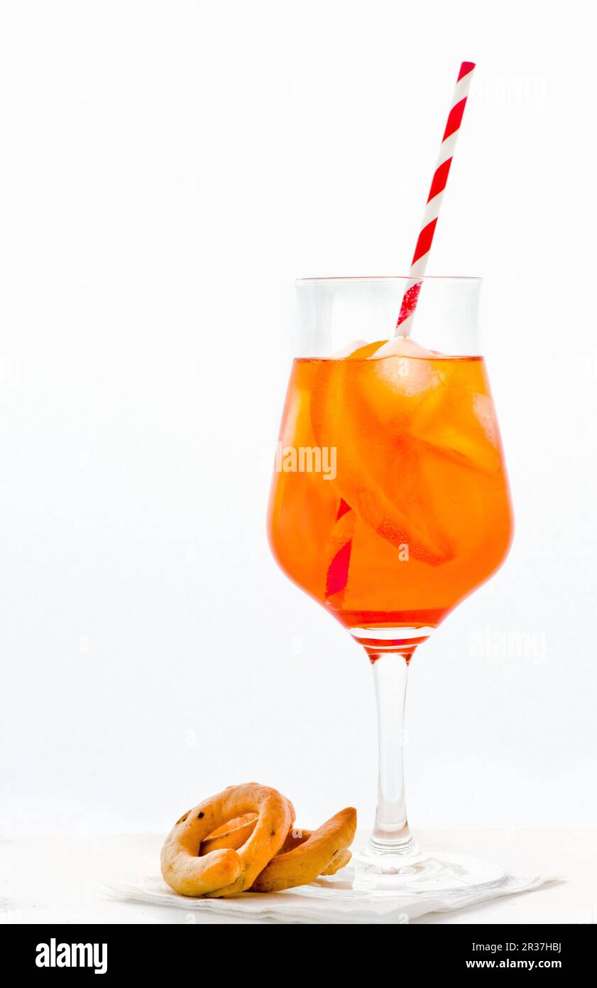 Aperol Spritz in a glass with straw Stock Photo - Alamy