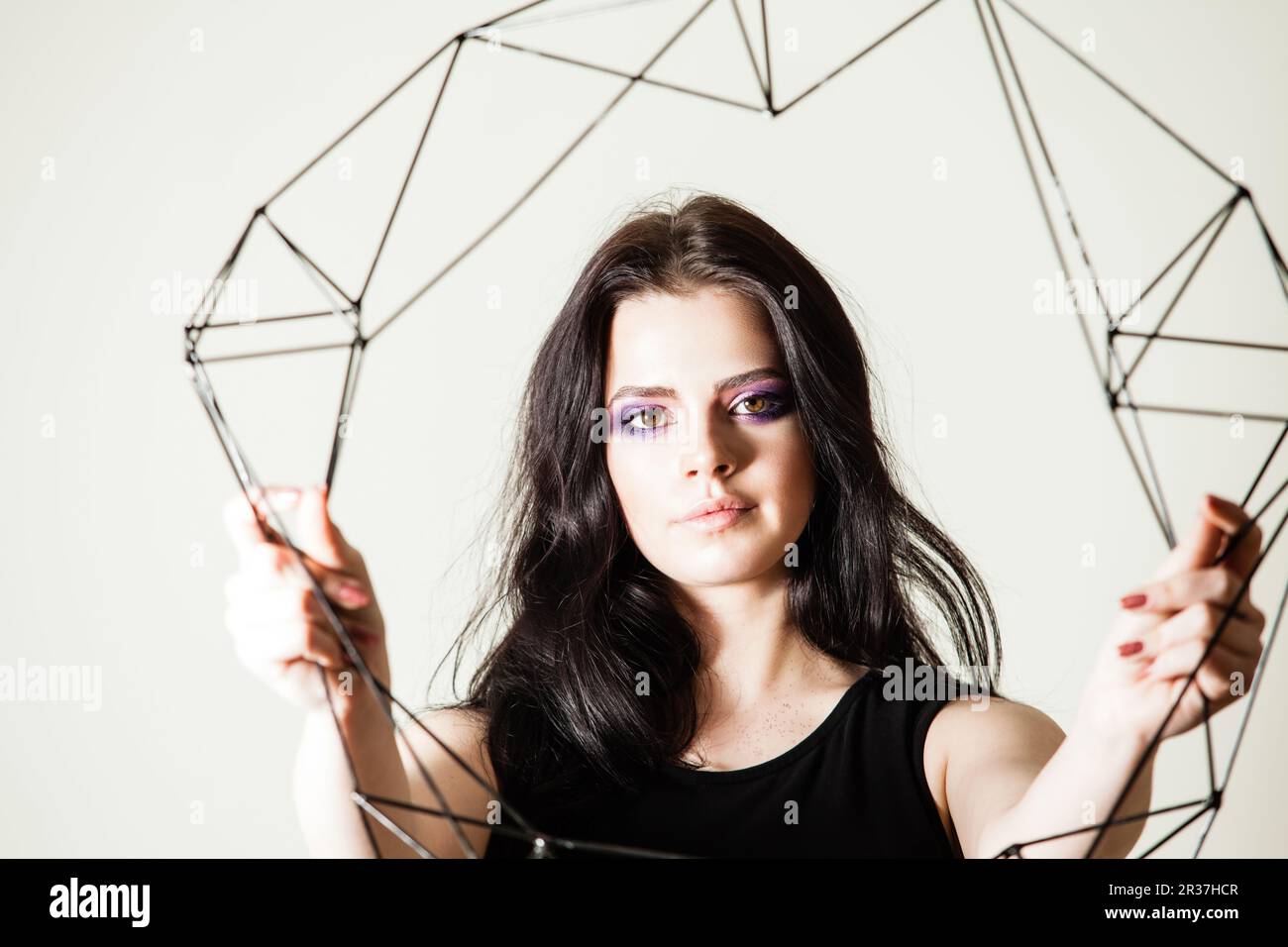 Female holding model of geometric solid Stock Photo - Alamy