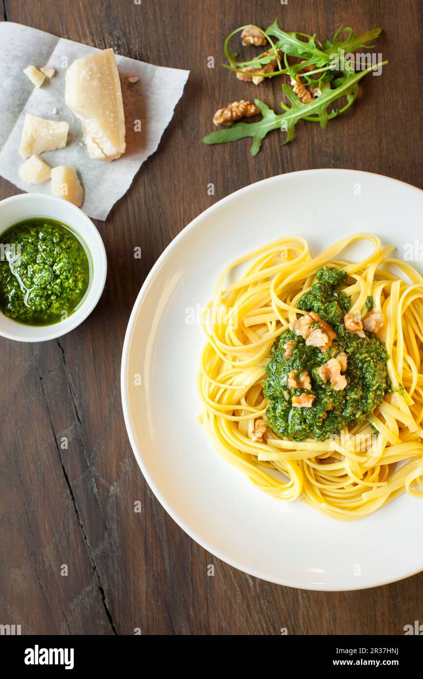 Bavette pasta with rocket pesto and walnuts Stock Photo - Alamy