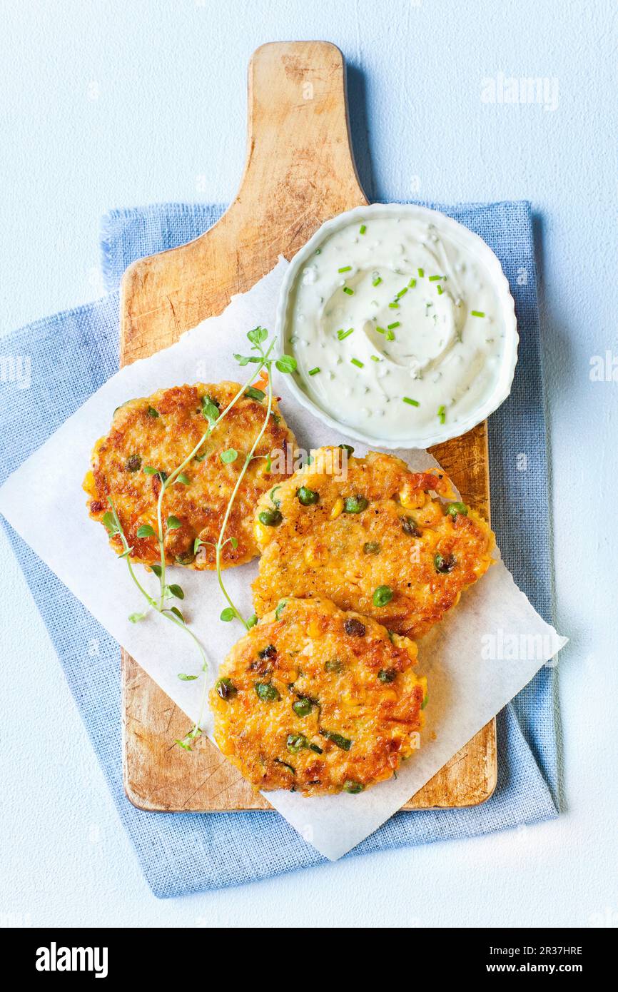 Vegetable rosti with herb dip Stock Photo - Alamy