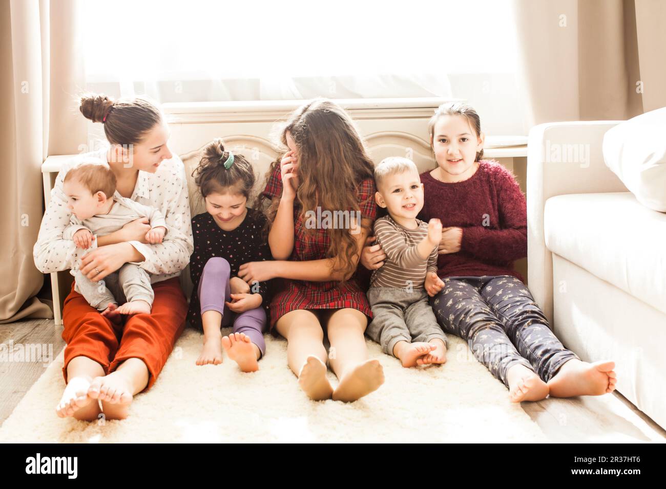 Big family of siblings Stock Photo - Alamy
