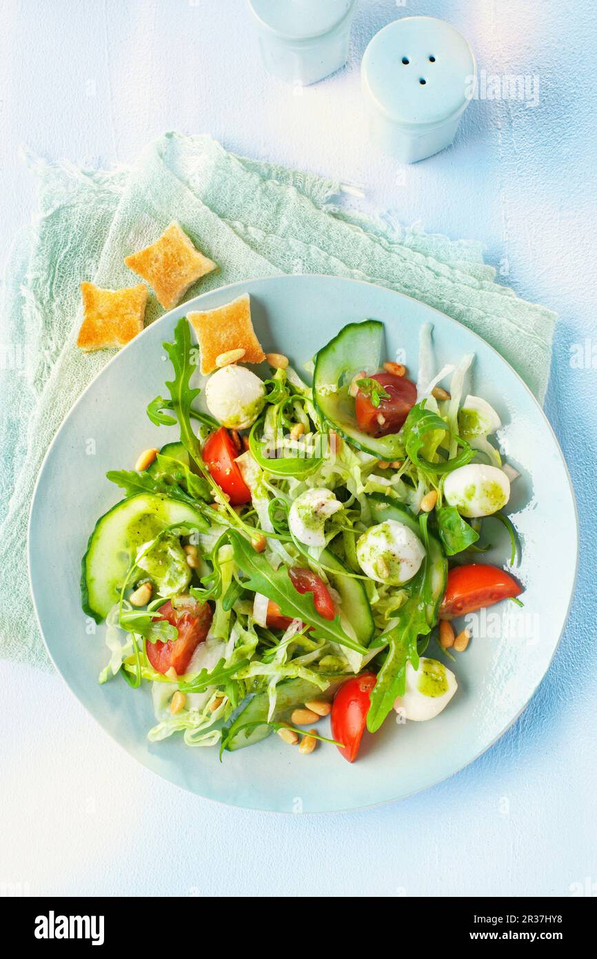 Rocket salad with mozzarella, cucumber and tomato Stock Photo - Alamy