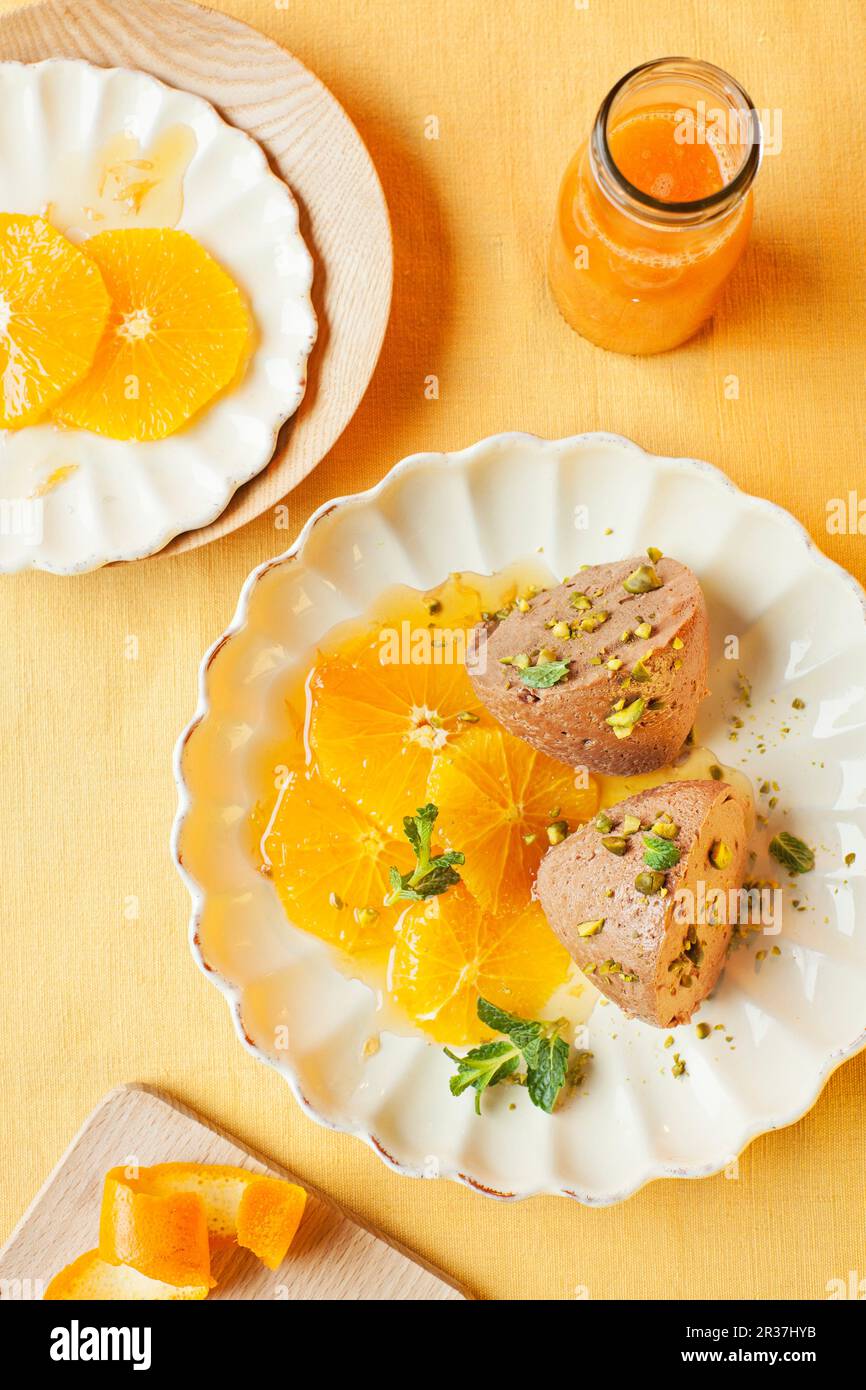 Toblerone mousse with orange slices and pistachios Stock Photo - Alamy