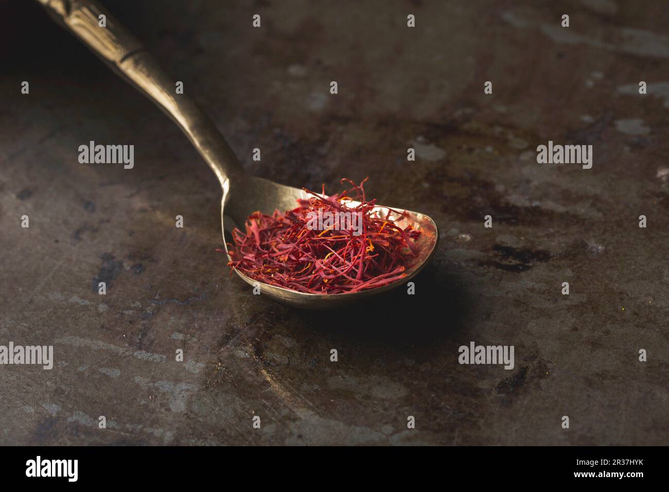 Saffron threads on a gold spoon Stock Photo - Alamy