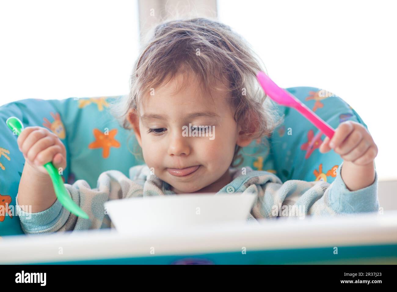 The girl is eating very fast Stock Photo - Alamy