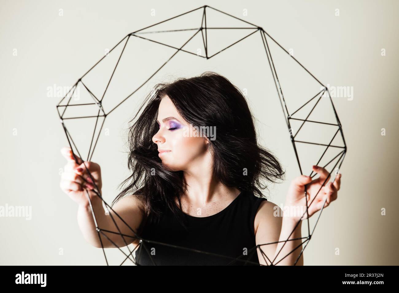 Female holding model of geometric solid Stock Photo - Alamy