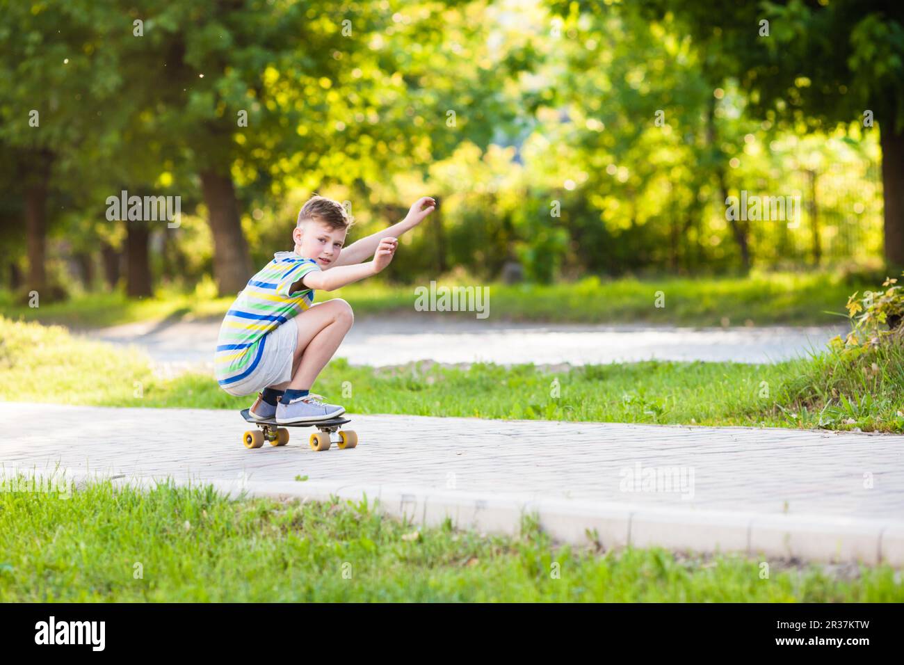 Boy riding a skateboard Stock Photo - Alamy