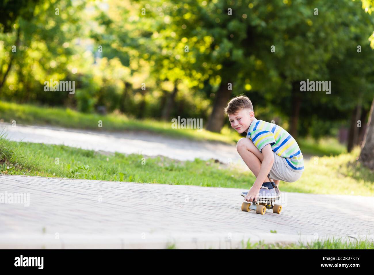 Boy riding a skateboard Stock Photo - Alamy