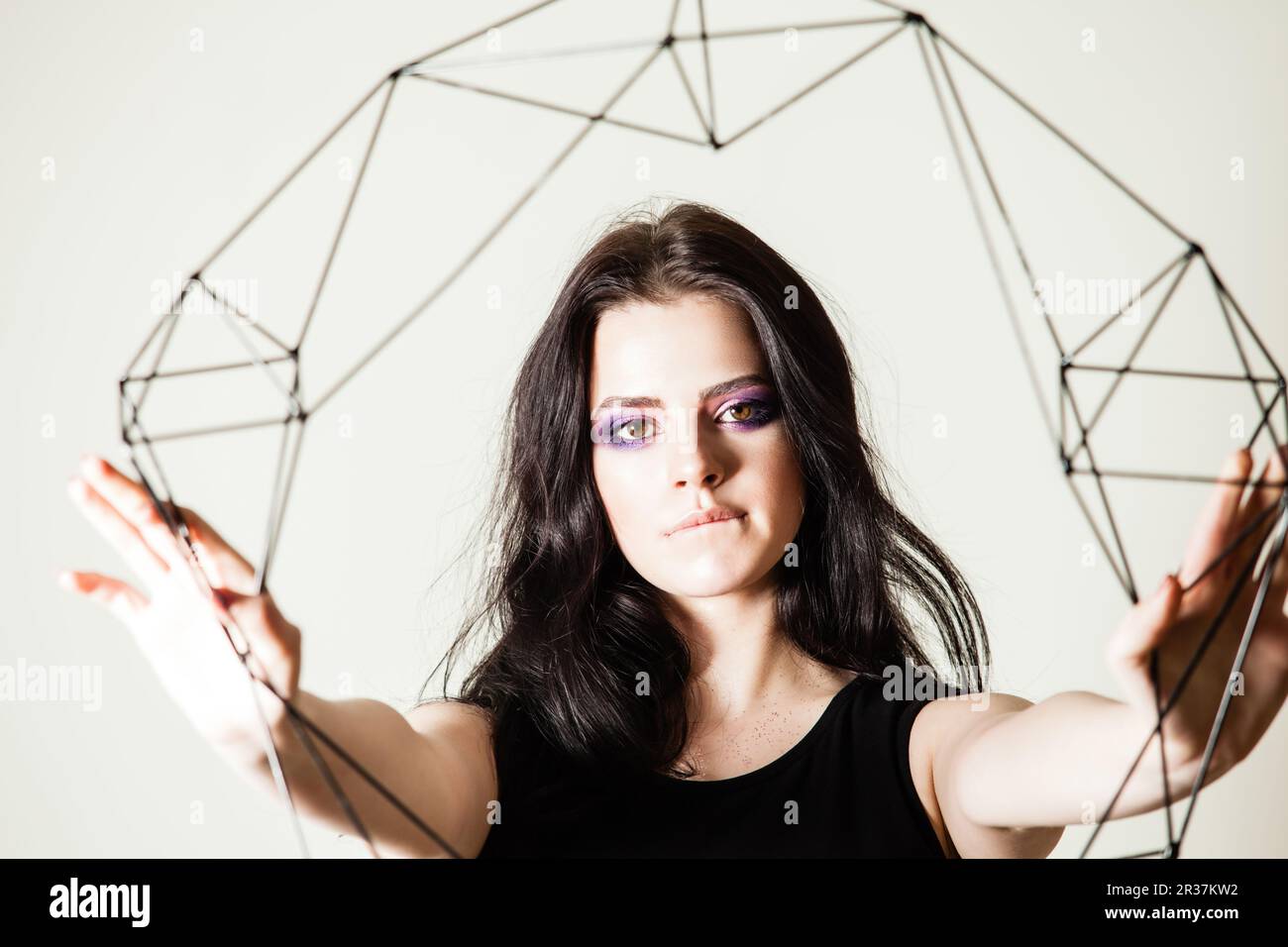 Female holding model of geometric solid Stock Photo - Alamy