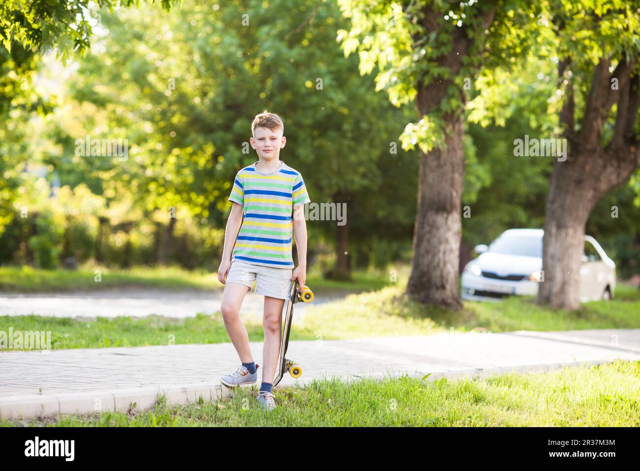 Boy riding a skateboard Stock Photo - Alamy