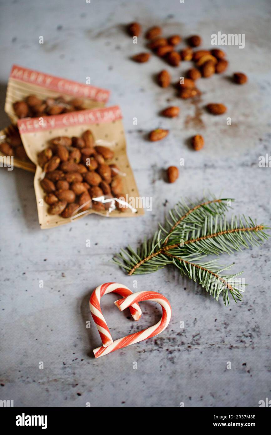 Rosemary and chilli almonds with a candy cane heart Stock Photo - Alamy