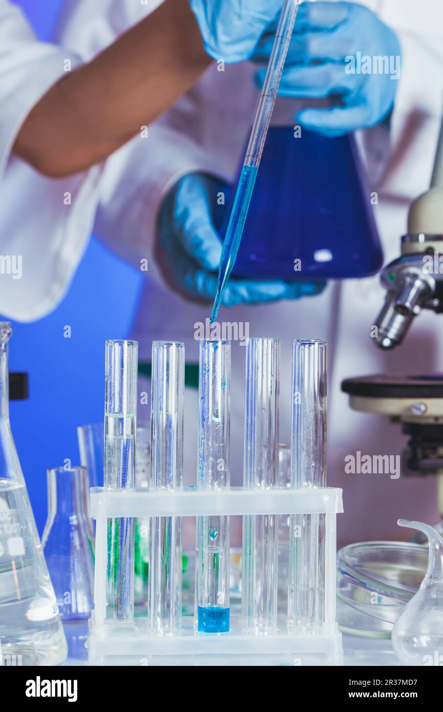 Scientists in laboratory chemical tubes hi-res stock photography and ...