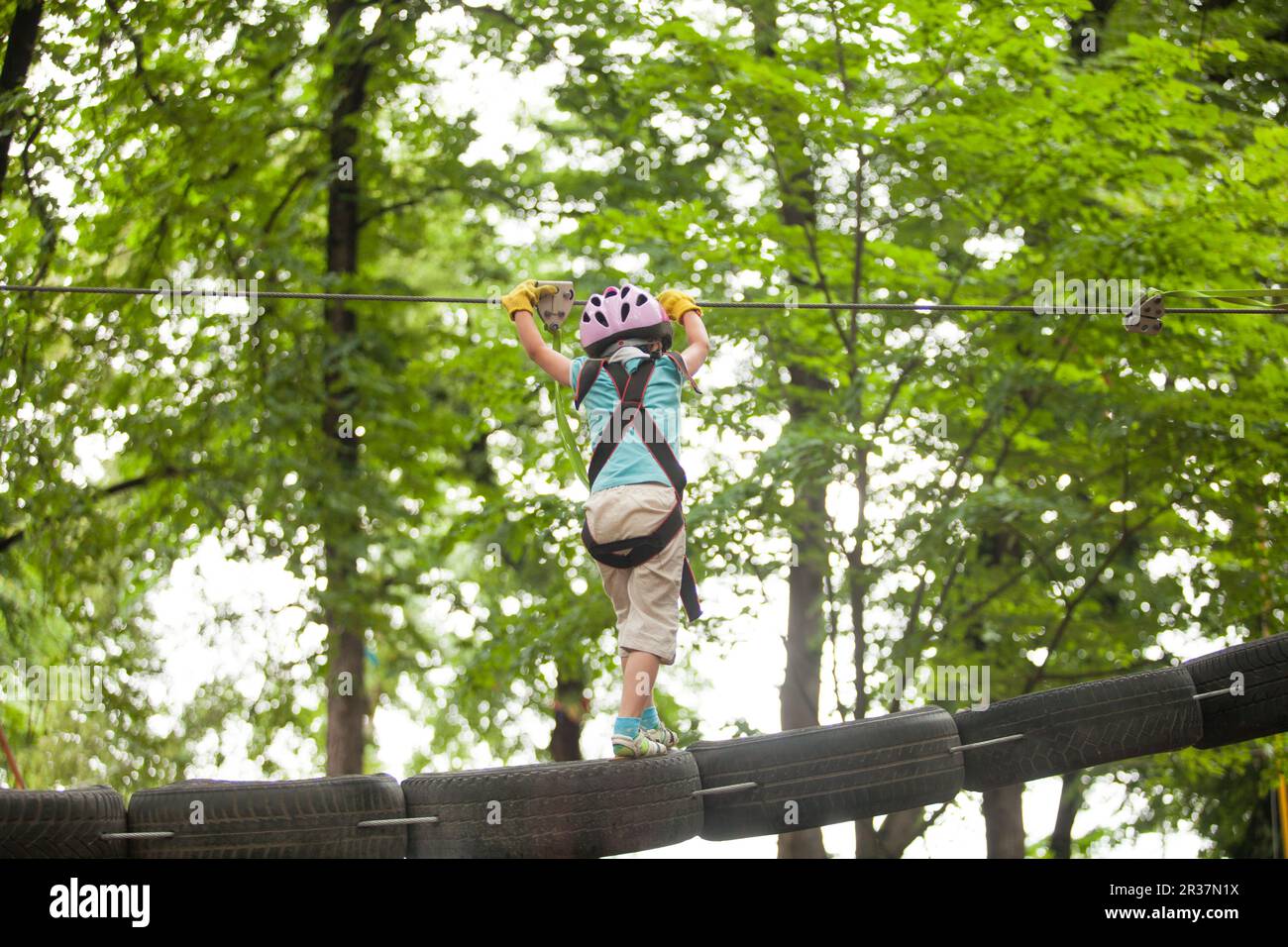 The obstacle course in adventure park Stock Photo - Alamy