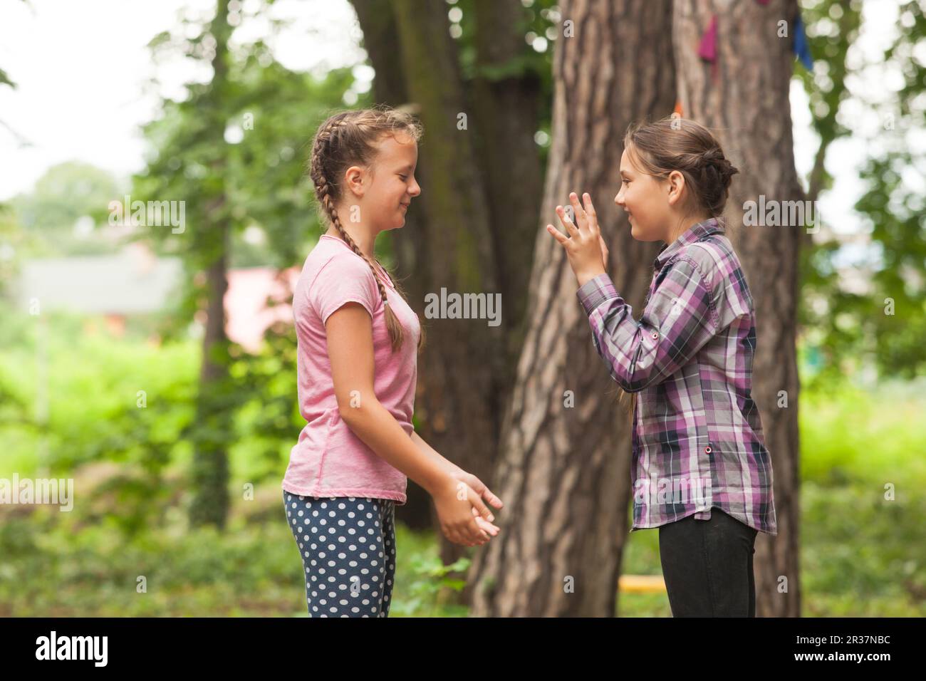 Two girls are playing Stock Photo - Alamy