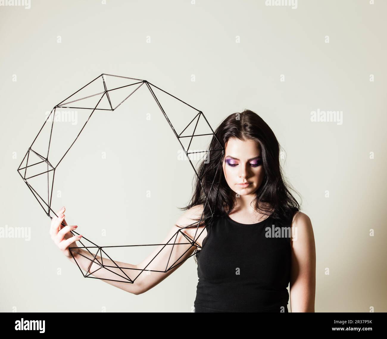 Female holding model of geometric solid Stock Photo - Alamy