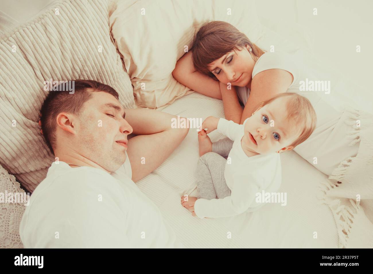 Tired and sleepy parents Stock Photo - Alamy