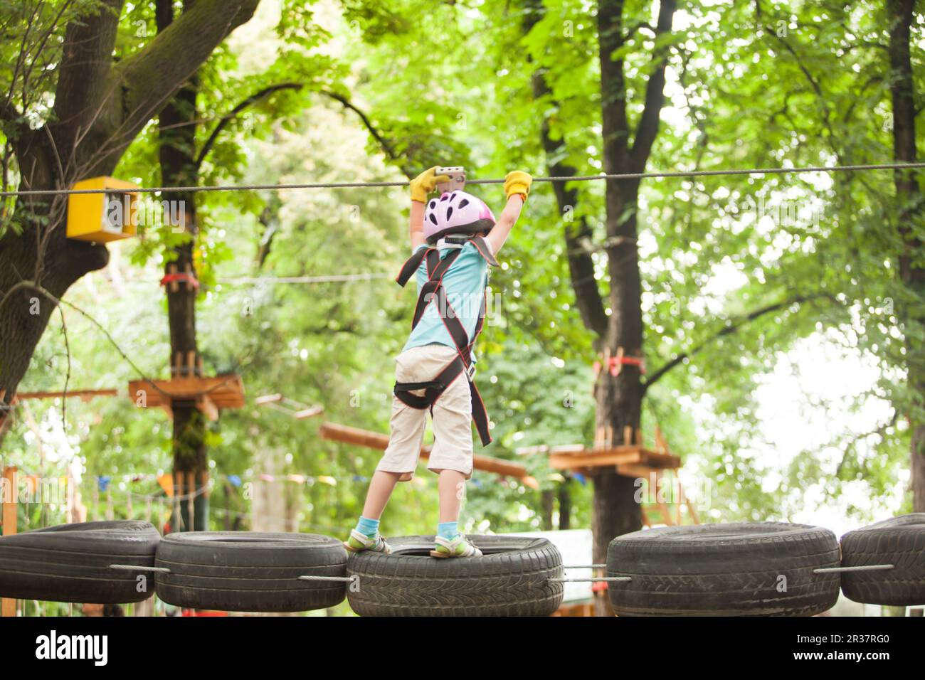 The obstacle course in adventure park Stock Photo - Alamy