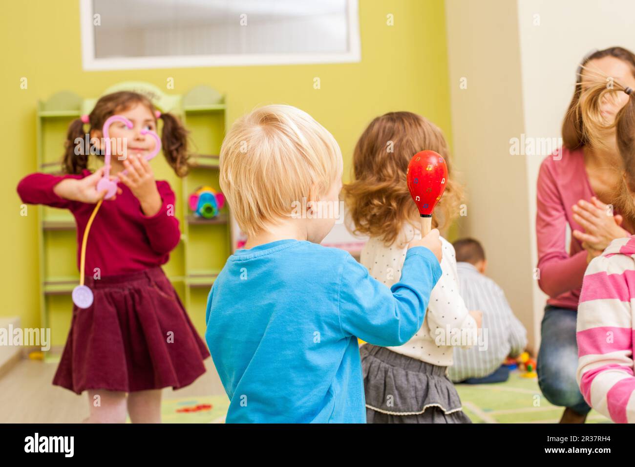 Group of little children dancing Stock Photo - Alamy