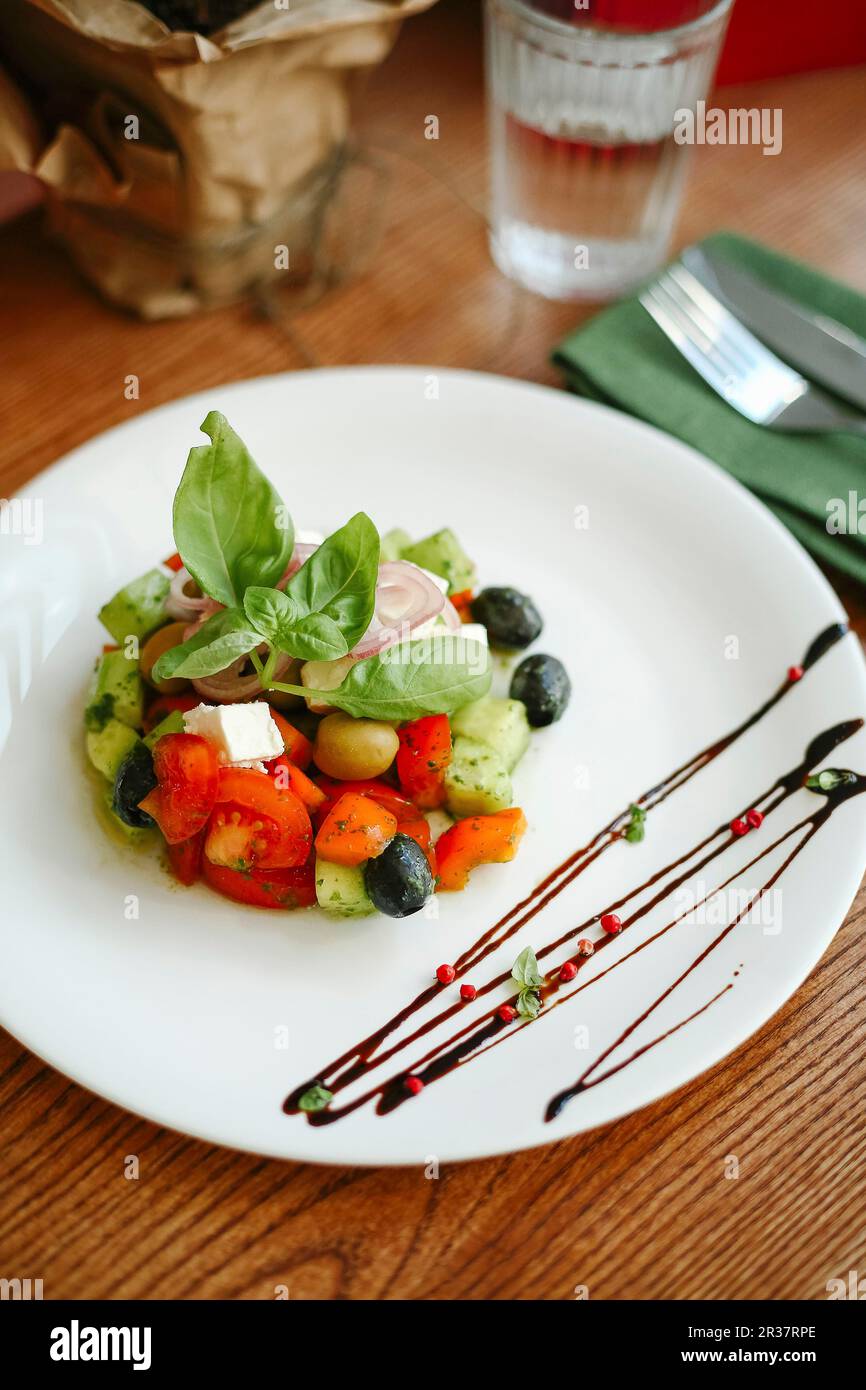 Greek salad with cucumber, tomatoes, olives and fete Stock Photo - Alamy