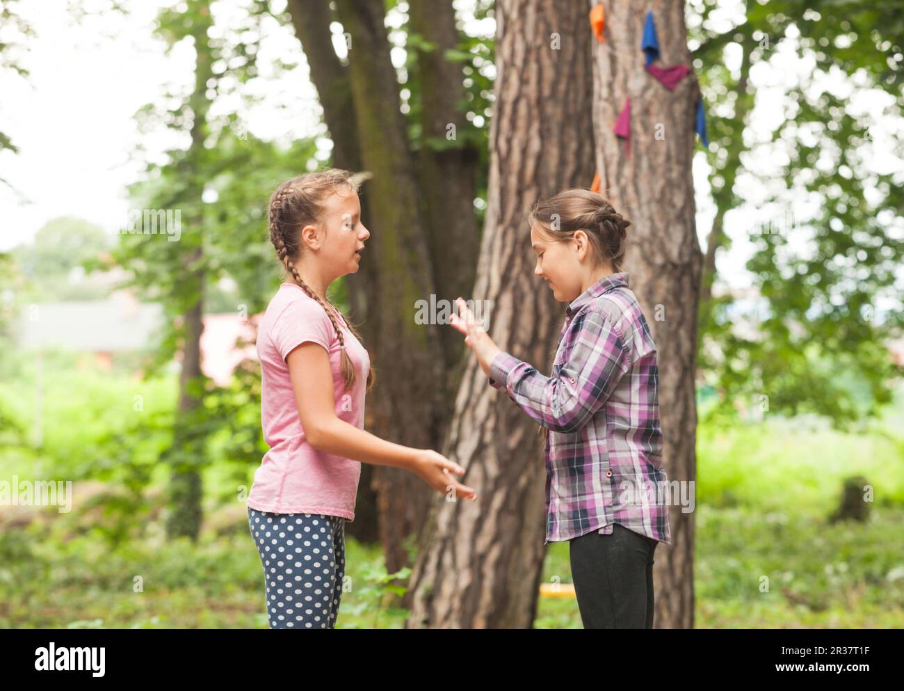 Two young girls playing outside hi-res stock photography and images - Alamy