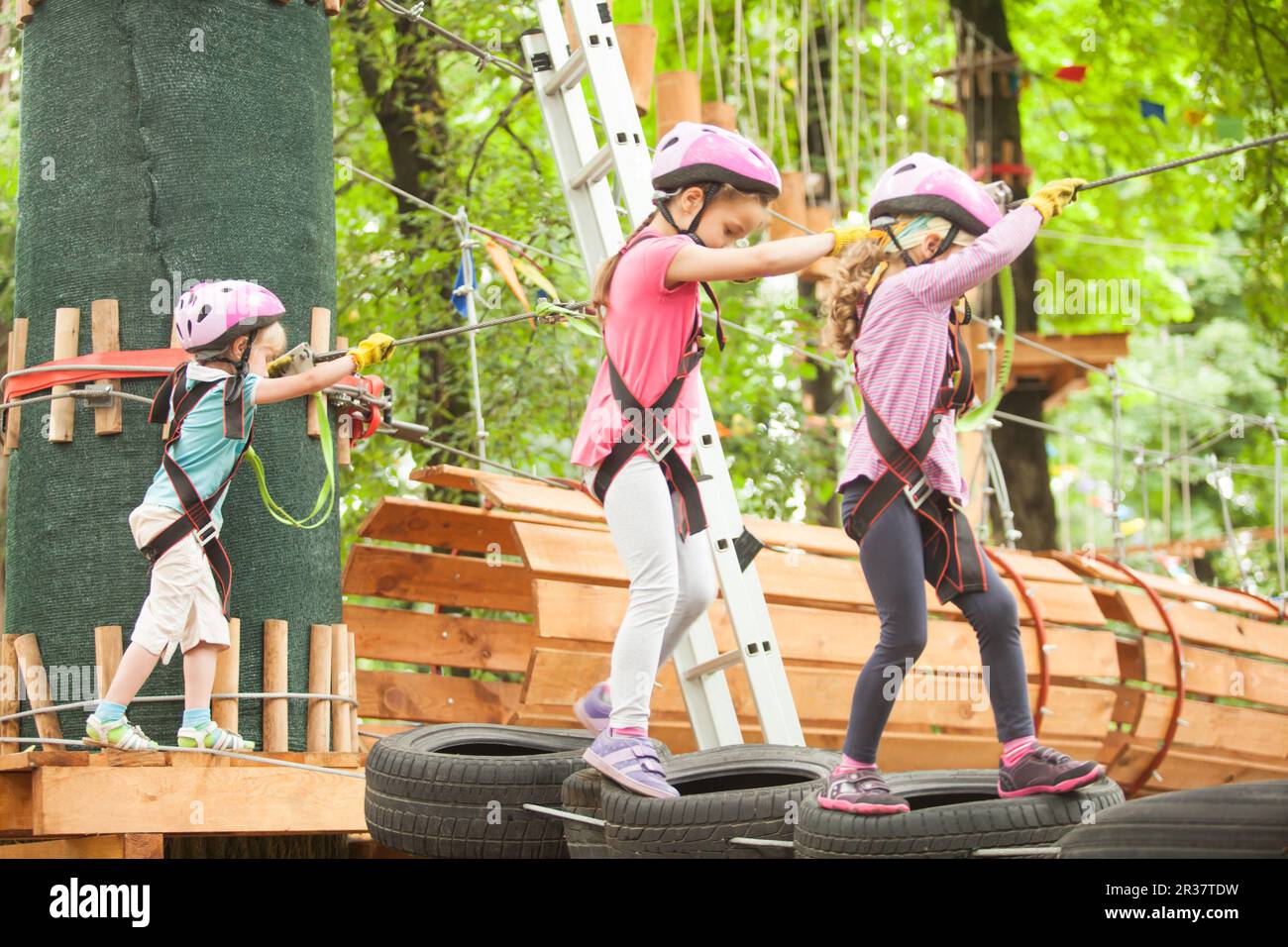 The obstacle course in adventure park Stock Photo - Alamy