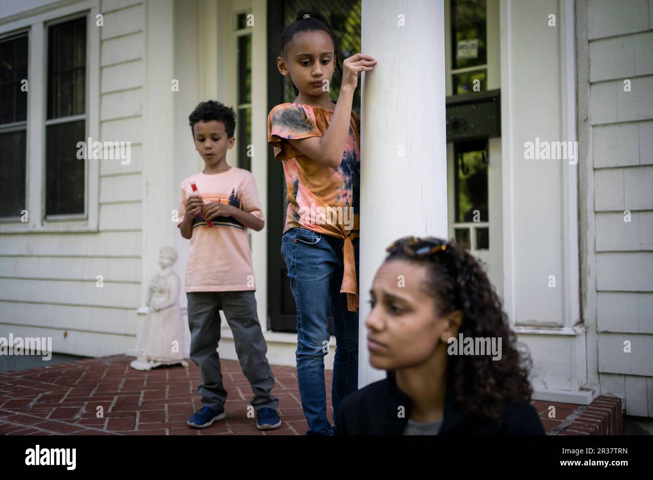 Catherine Manson sits on the front porch of her aunt's home as her ...